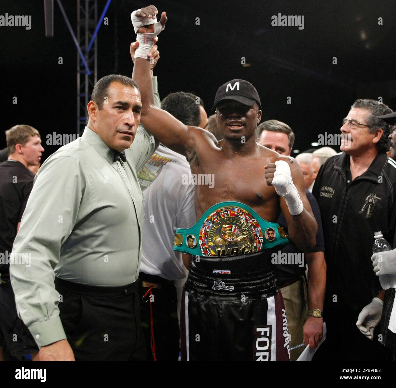Referee Mike Ortega holds up the right arm of Vernon Forrest after ...