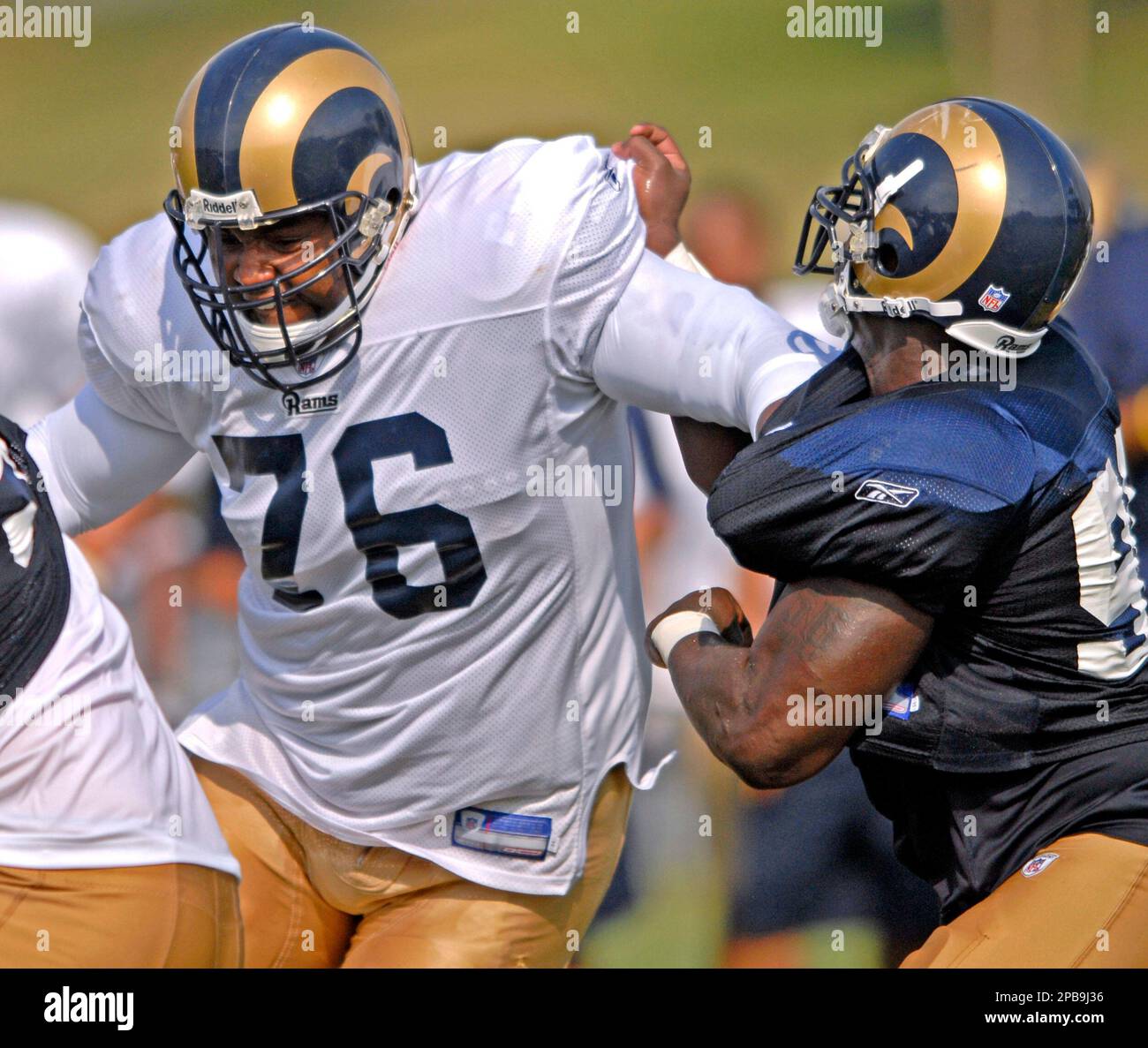 St. Louis Rams offensive lineman Orlando Pace (76) puts a block on ...