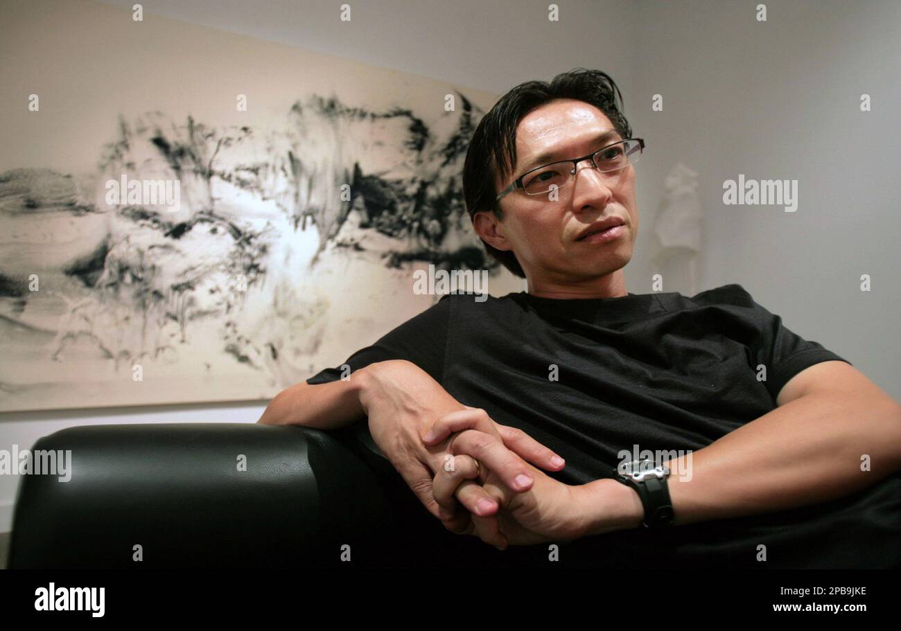 Artist Mako Fujimura poses in front of his work "Water Stones III" at ...