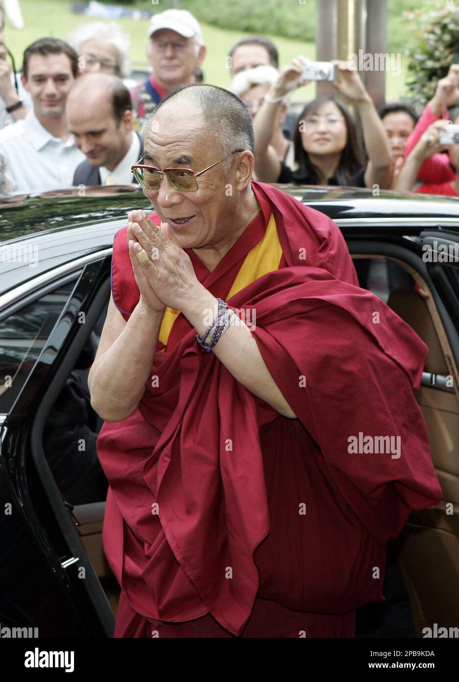 Tibetan spiritual leader, the Dalai Lama, greets upon his arrival in ...