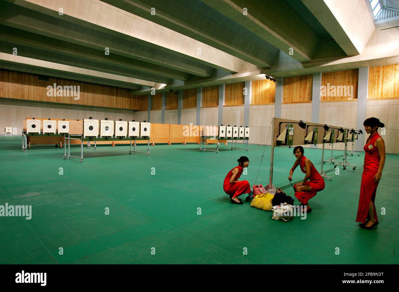 Chinese women in traditional outfits take part in the ceremonies of the ...