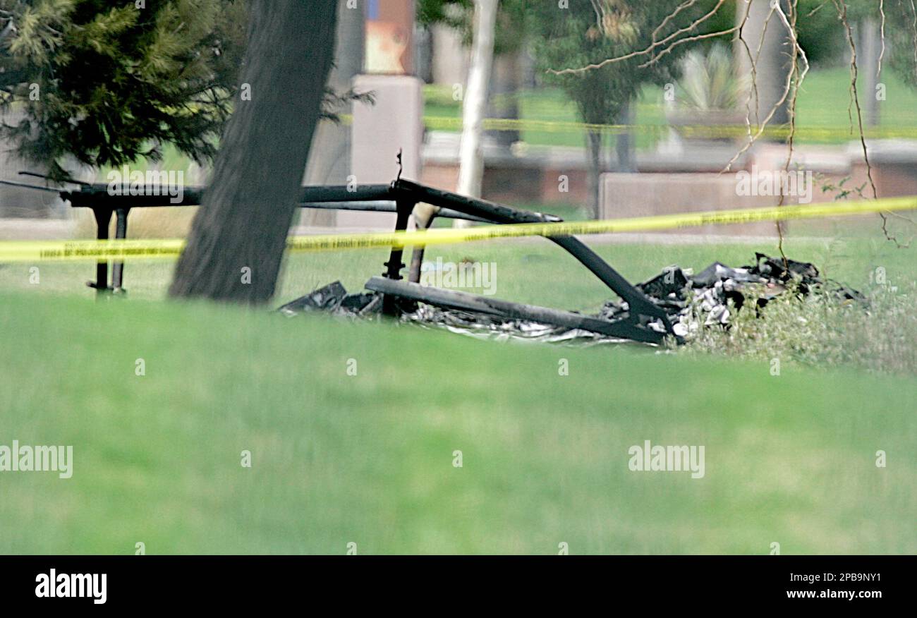 A section of charred helicopter frame is seen at a two-helicopter crash ...