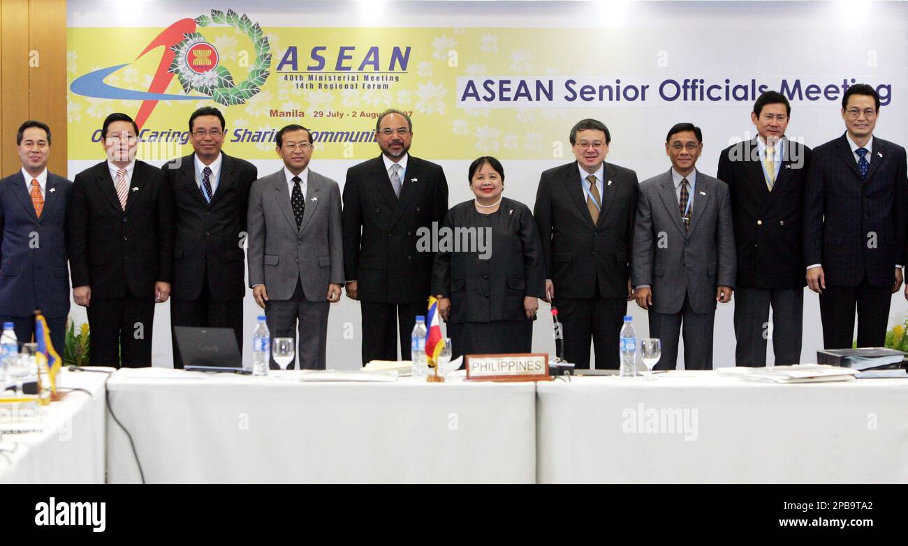 Senior officials of the ASEAN pose for photo session prior to the start ...