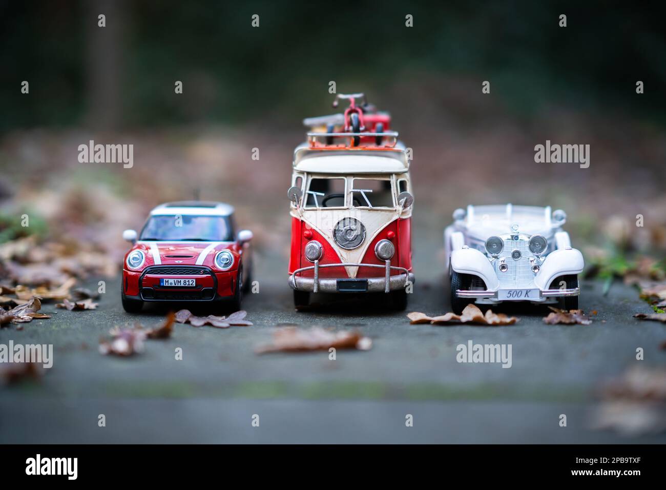 Vintage charm on fallen leaves: Mini Cooper, VW T1, and Benz 500K ...