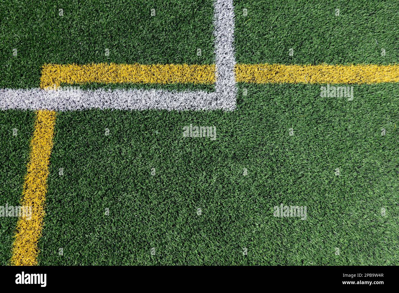 Green artificial grass turf soccer football field background with white ...