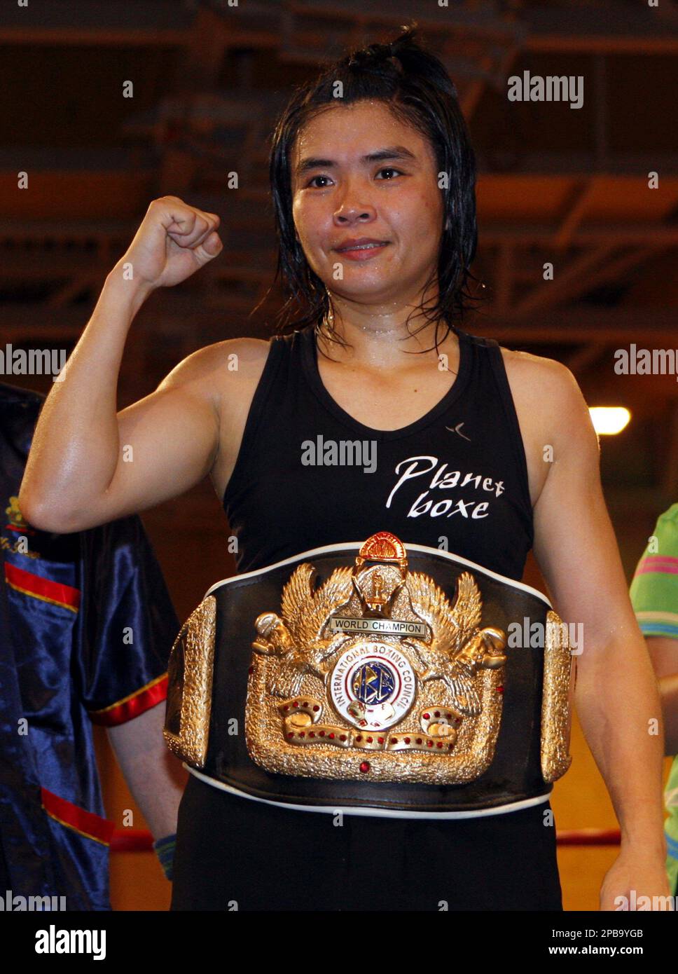 Chinese boxer Zhang Xi Yan, celebrates after winning her IWBC World ...