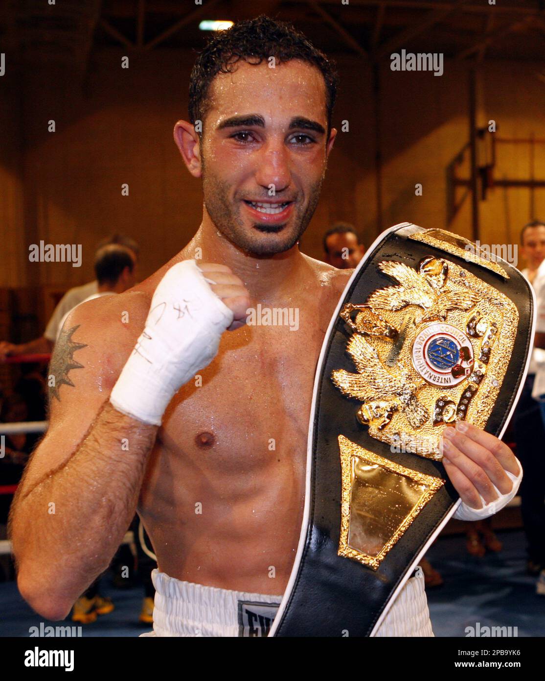 Swiss boxer Roberto Belge, celebrates after winning his fight IBC ...