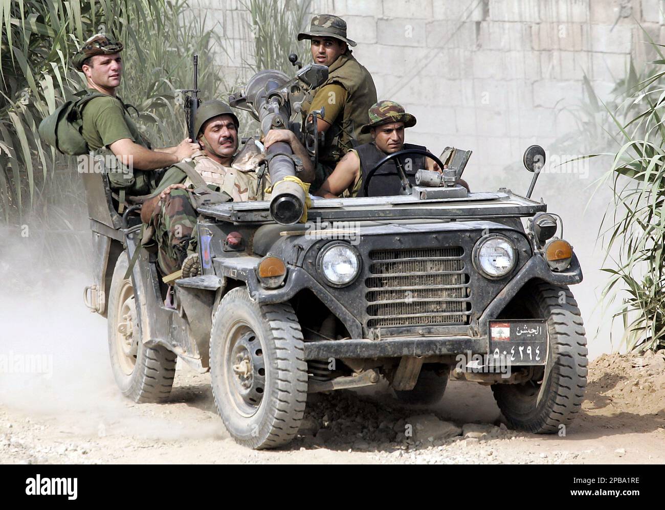Lebanese army soldiers sit on their armored vehicle with a 106mm ...