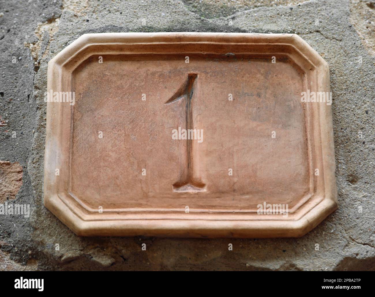 large street number of the house with the digit 1 on the marble tile ...