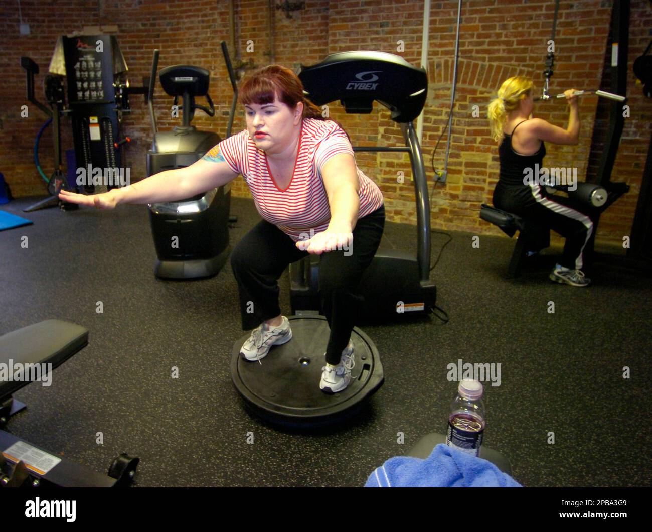 Stacey Barich works out at the Agora gym Wednesday, June 26, 2007.(AP ...
