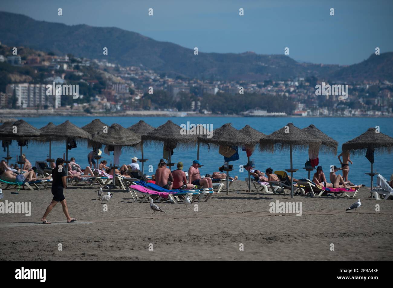 Malaga, Spain. 12th Mar, 2023. Bathers are seen at Malagueta beach ...