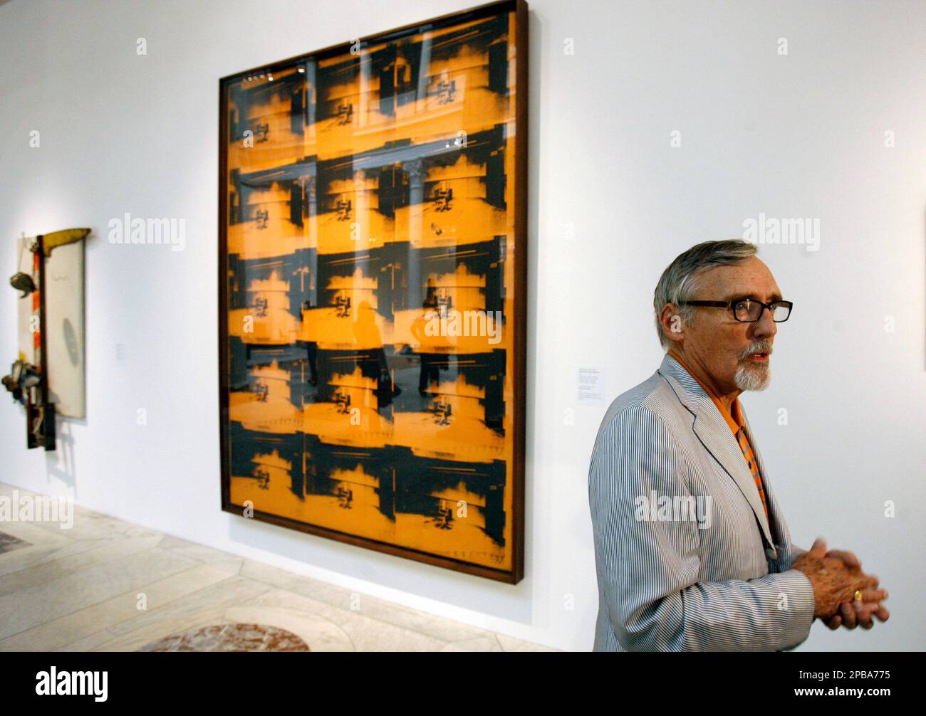 American actor Dennis Hopper walks past Andy Warhol's 'Orange Disaster ...