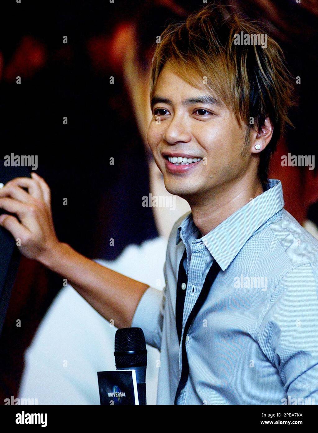 Hong Kong singer Hacken Lee smiles as he promotes his new album in Hong ...