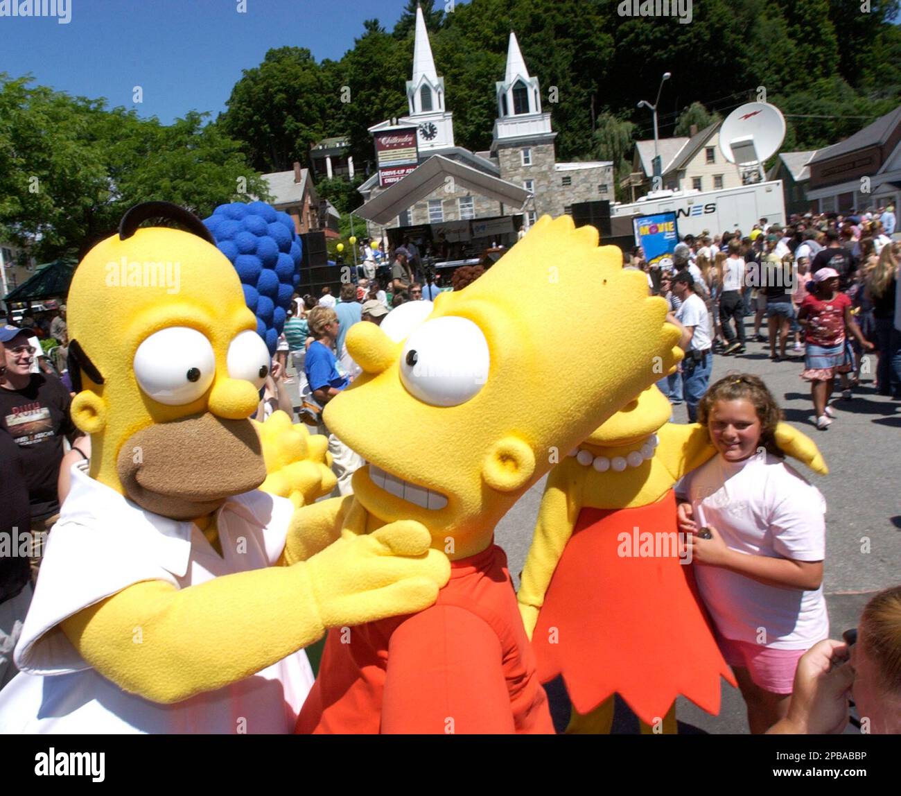 Character Homer Simpson, left, plays for the crowd and grabs Bart ...