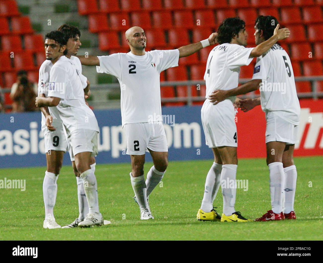 Iraq soccer teammates celebrate after beating Vietnam during their ...