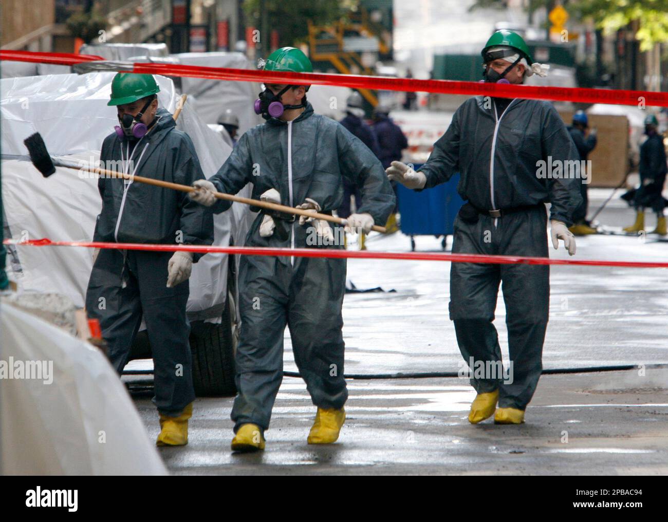 Workers continue to clean up the site near a steam pipe explosion in ...