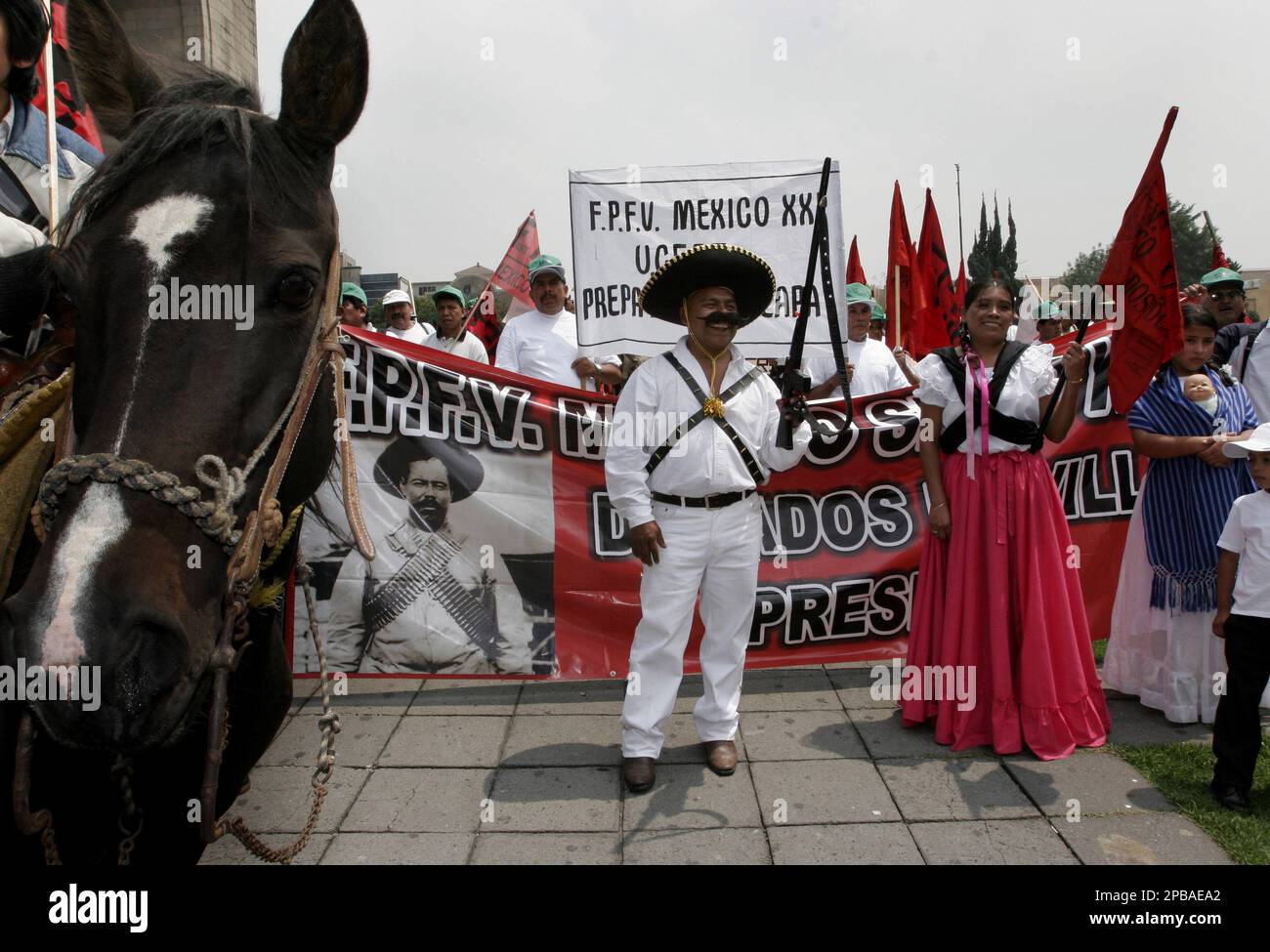 Members of the Pancho Villa movement march in Mexico City, Friday, July ...