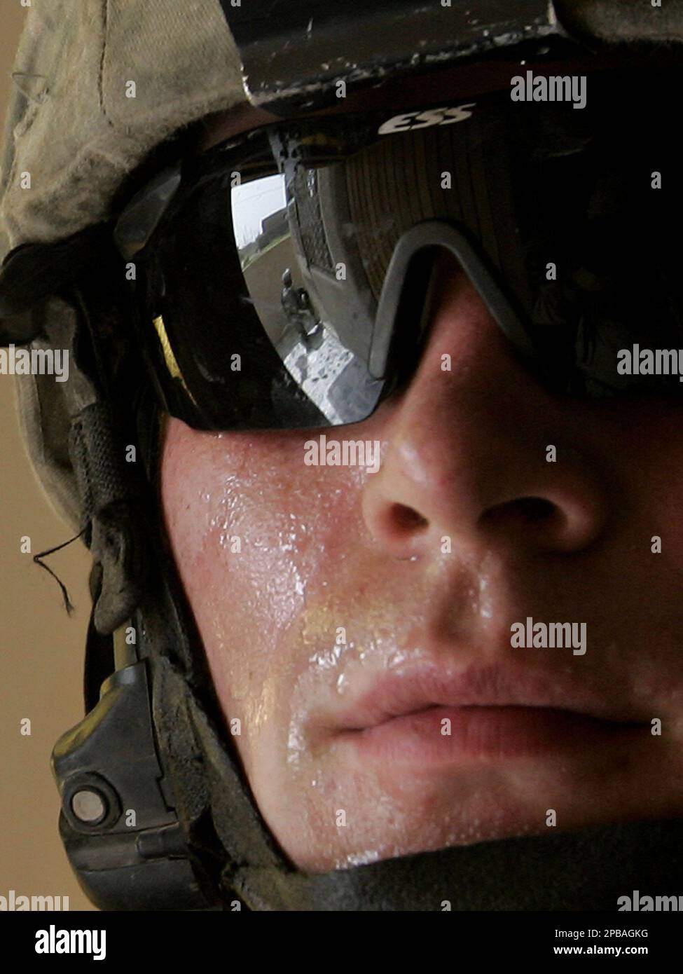 A U.S soldier of the 2nd brigade, 23rd infantry regiment is covered in ...