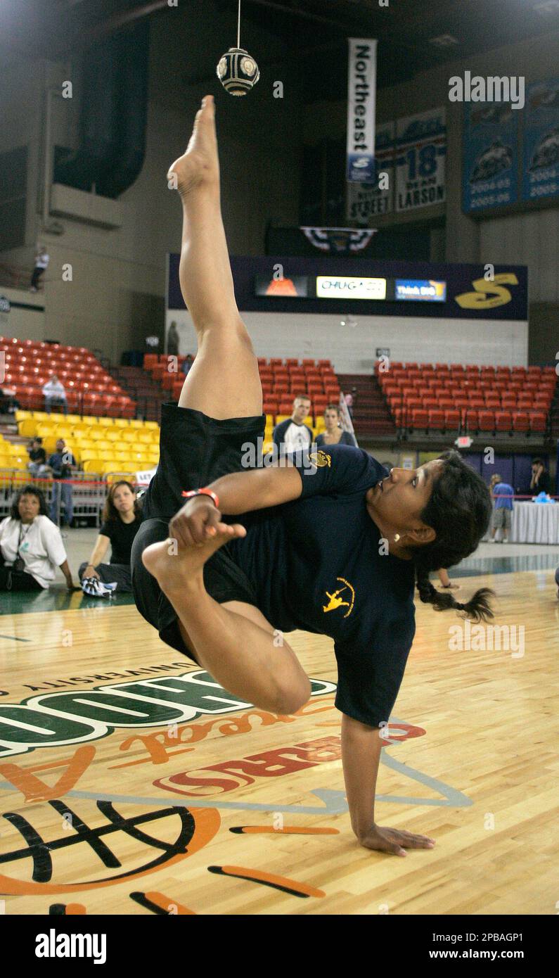 Marjorie Tahbone kicks a skin ball suspended 64 inches above the floor ...