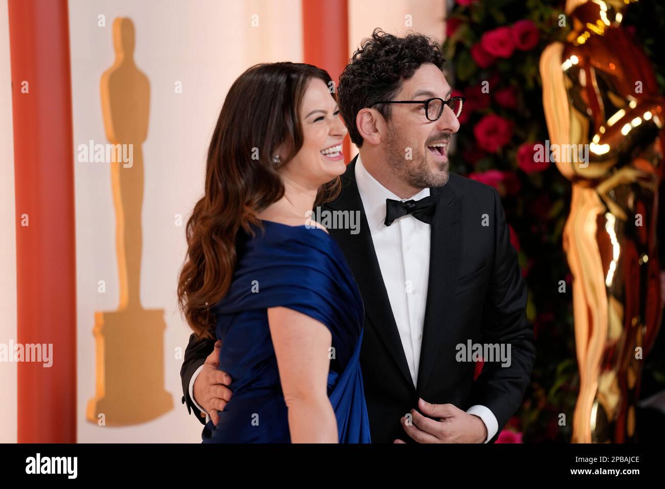 Kate Lowes, left, and Adam Shapiro arrive at the Oscars on Sunday ...
