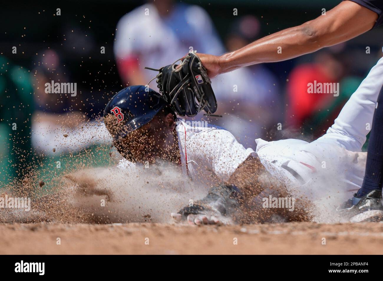 Boston Red Sox Greg Allen scores as he slides into home plate while New ...
