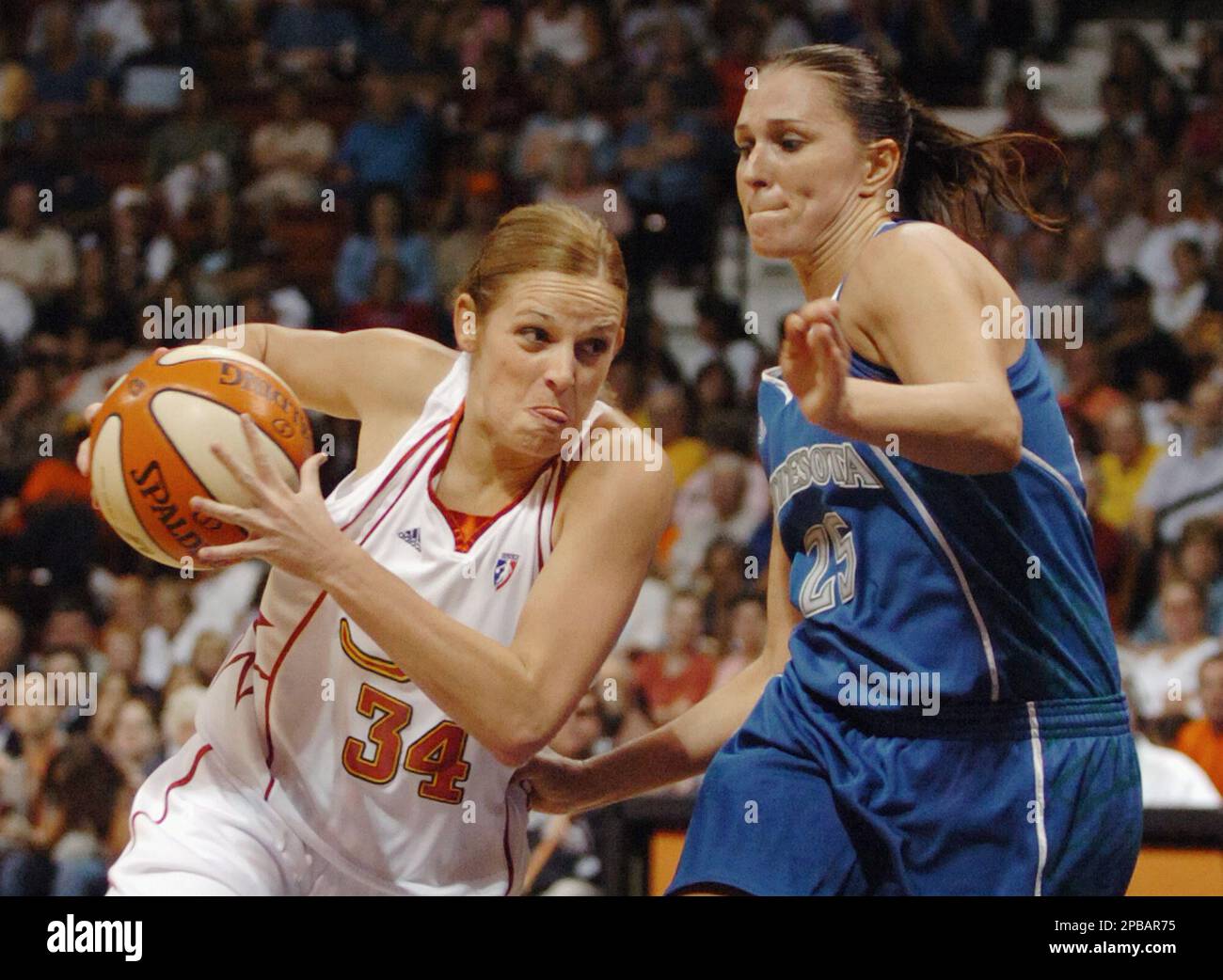 Connecticut Sun's Megan Mahoney (34) drives past Minnesota Lynx's ...