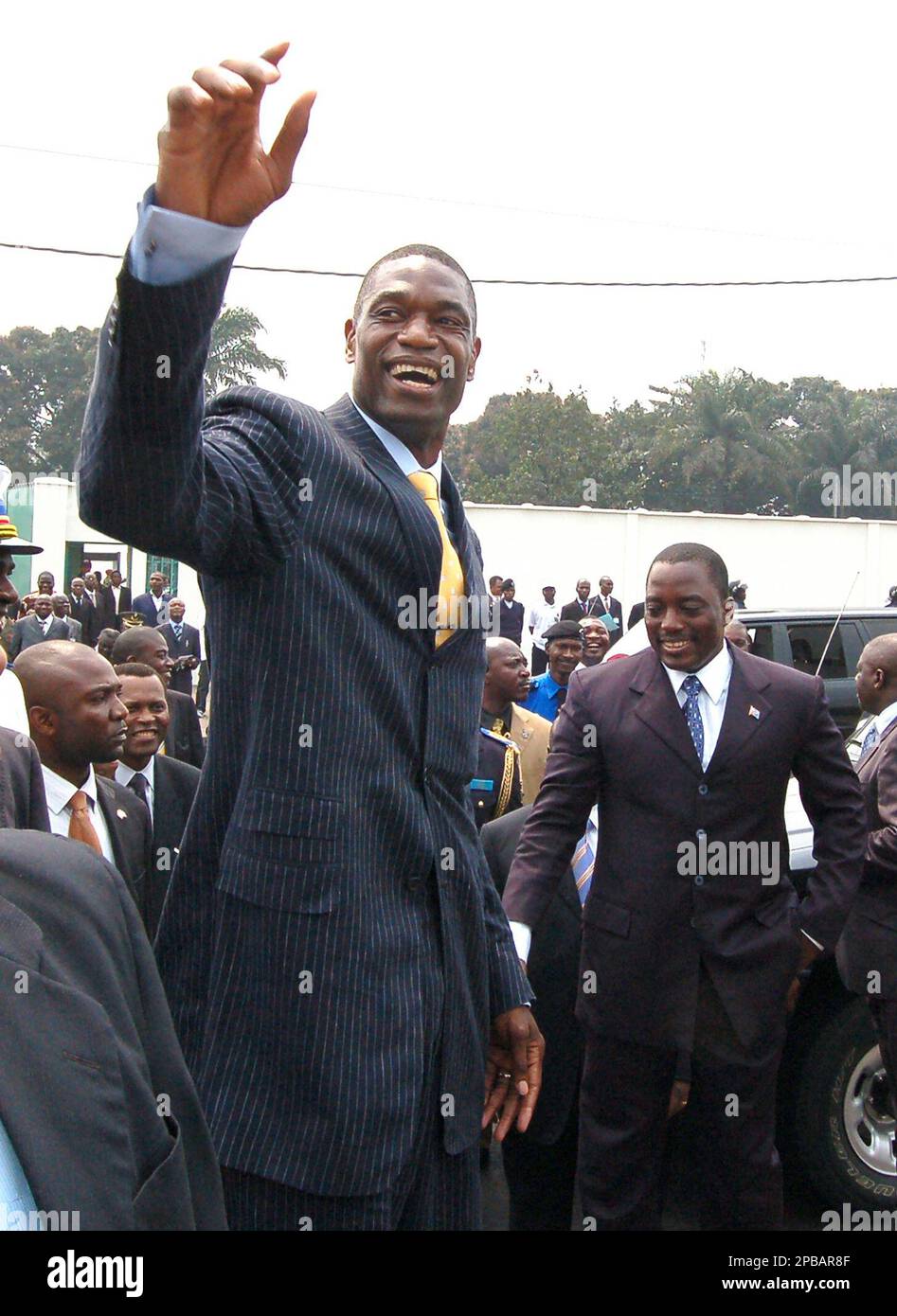 NBA basketball star Dikembe Mutombo waves as he stands with Congo ...