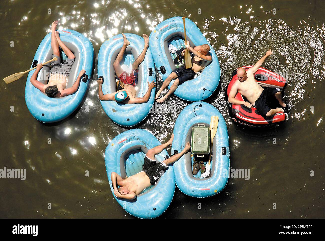 A group of men beat the heat in Yuma, Ariz., Monday, July 16, 2007, by ...
