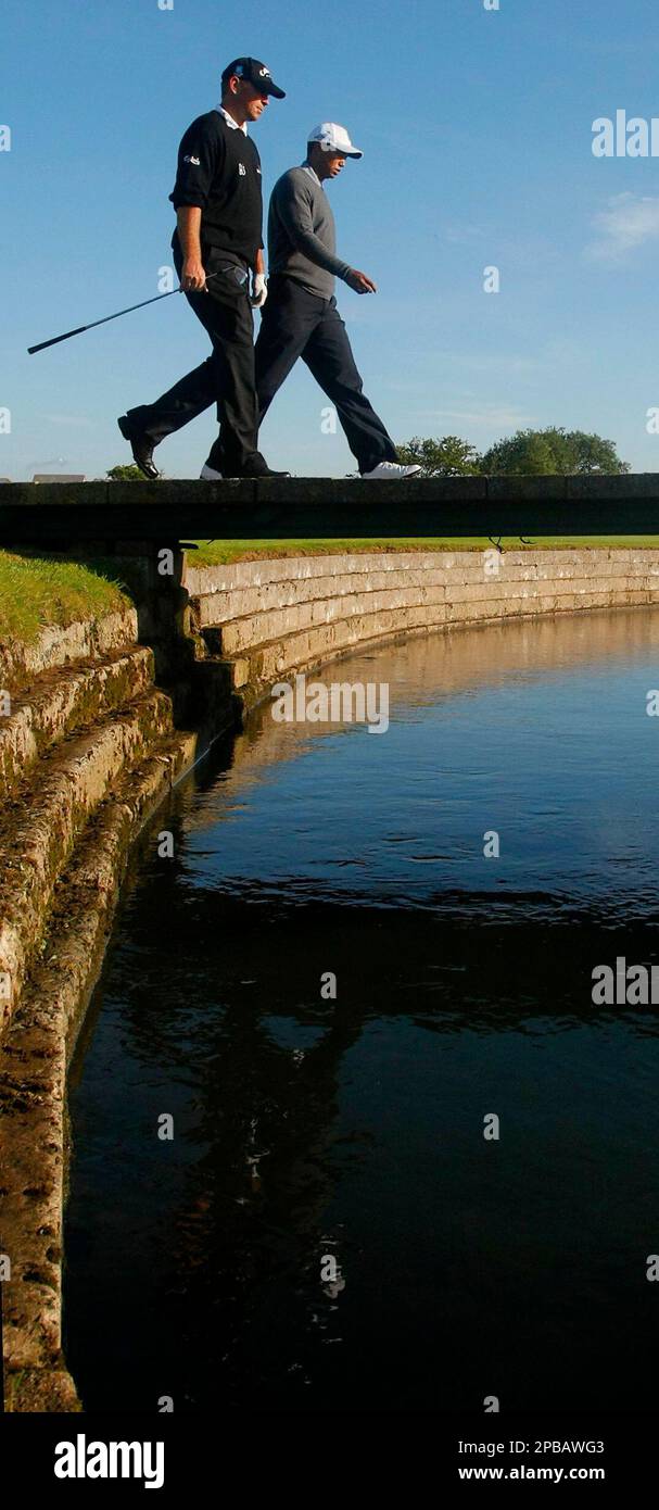 Tiger Woods of the United States, right, and Denmark's Thomas Bjorn ...