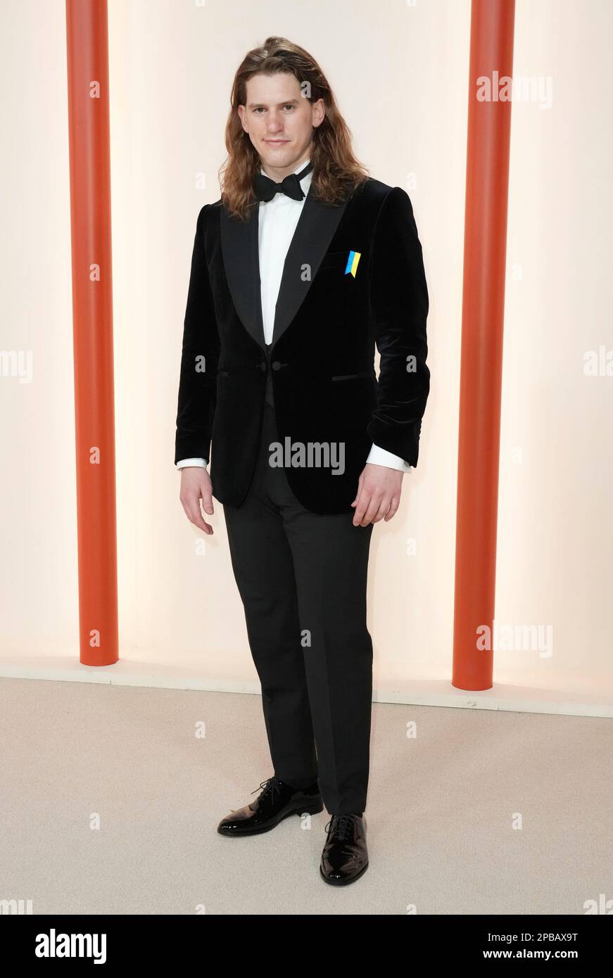 Michal Dymek, wearing a pin in support of Ukraine, arrives at the ...