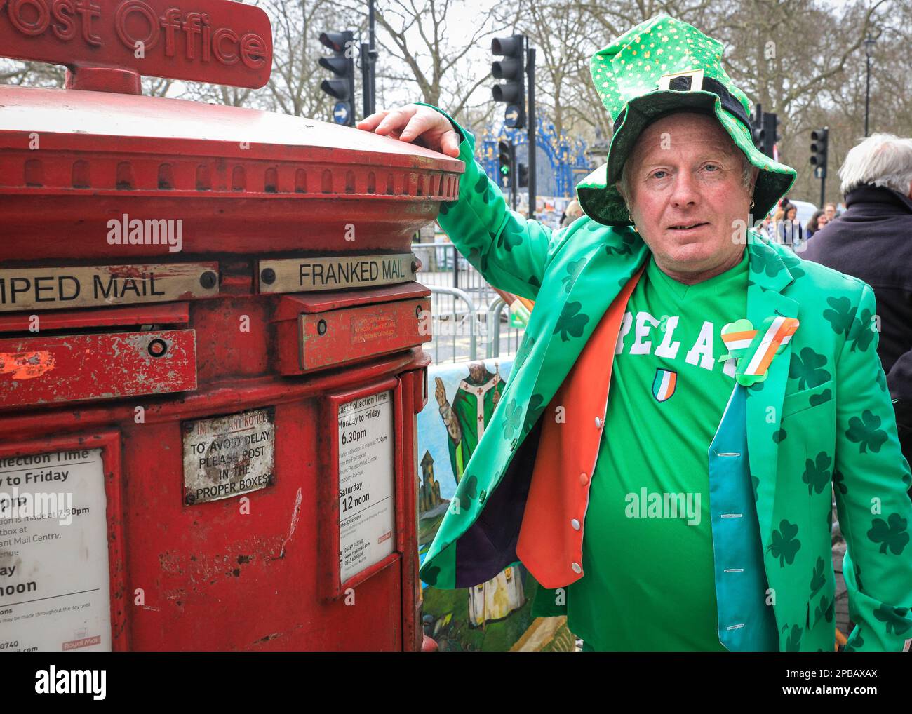 London, UK. 12th Mar, 2023. A spectator in full green shamrock outfit ...