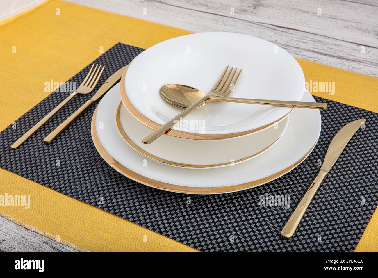 Plates and utensils, Plate, Bowl and golden cutlery on dining table ...