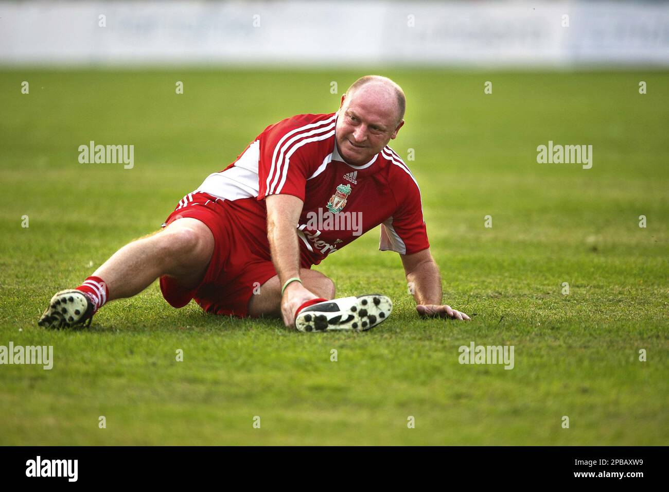Former Liverpool midfield star Steve McMahon holds his leg afteran ...