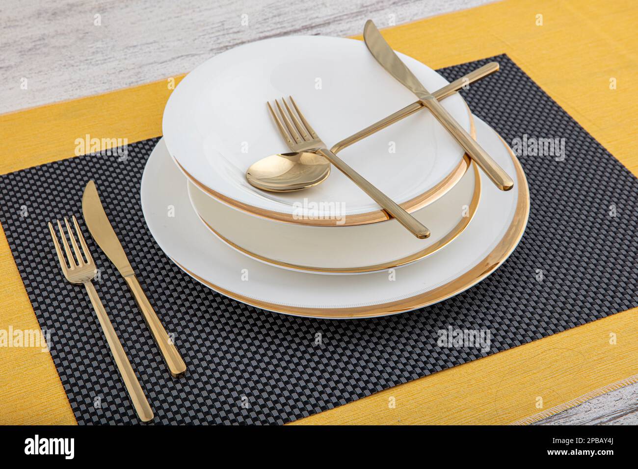 Plates and utensils, Plate, Bowl and golden cutlery on dining table ...
