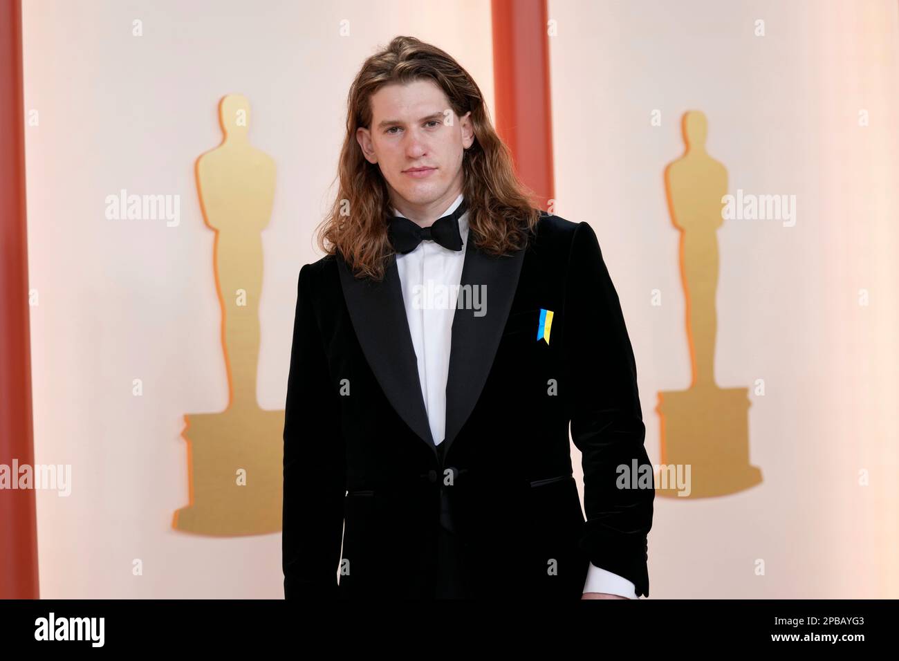 Michal Dymek, wearing a pin in support of Ukraine, arrives at the ...