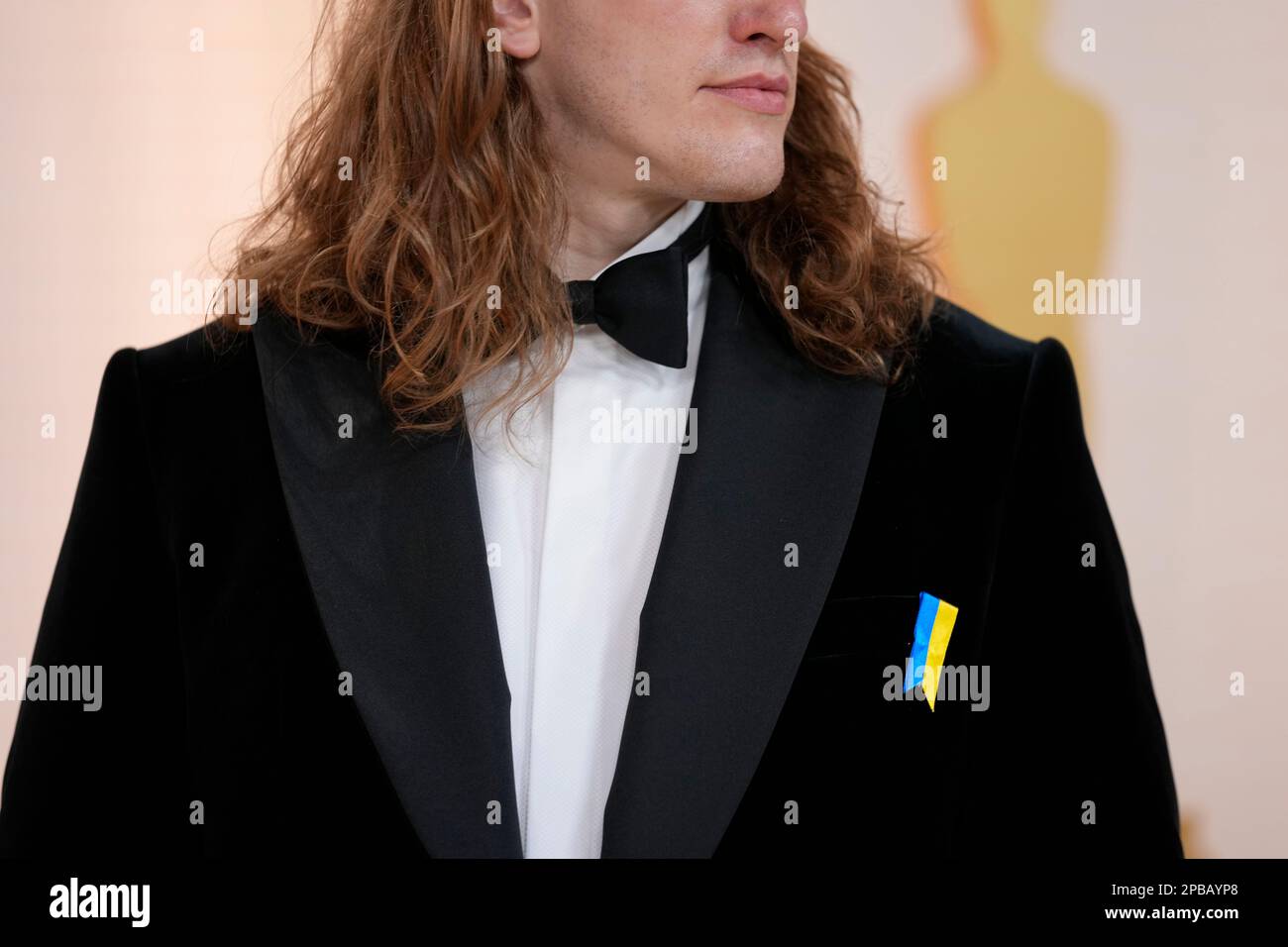 Michal Dymek, wearing a pin in support of Ukraine, arrives at the ...