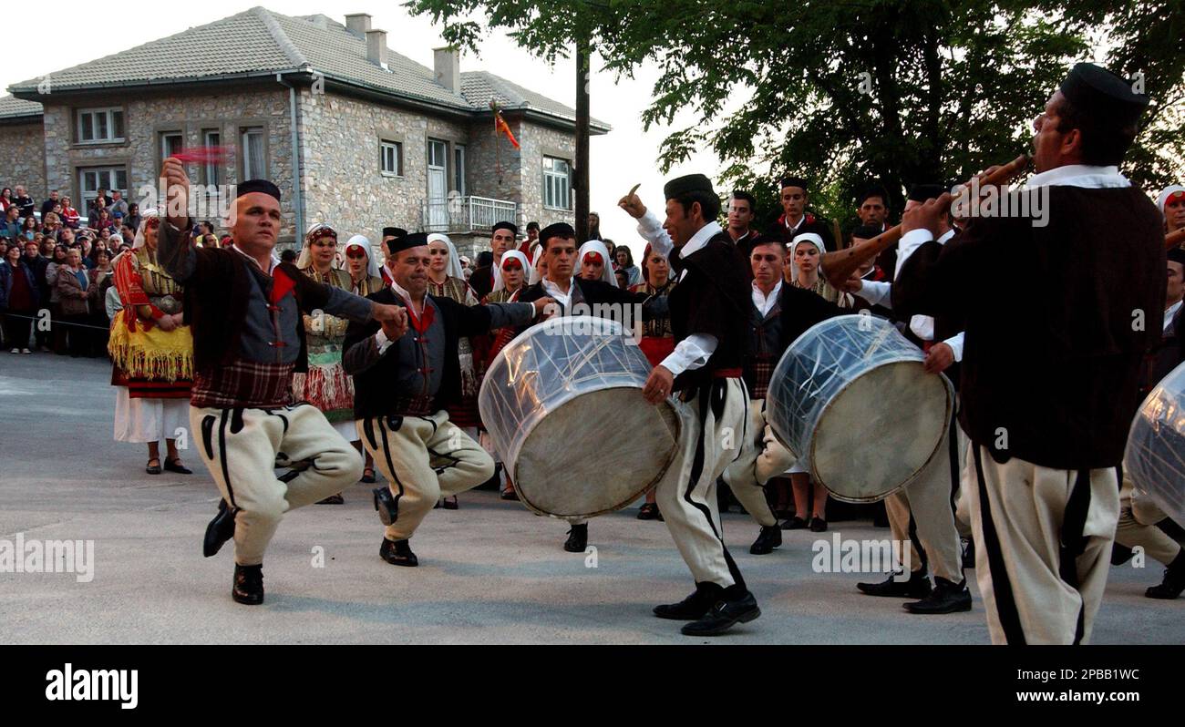 Men dance the "Teskoto" folk dance, a night before the traditional ...