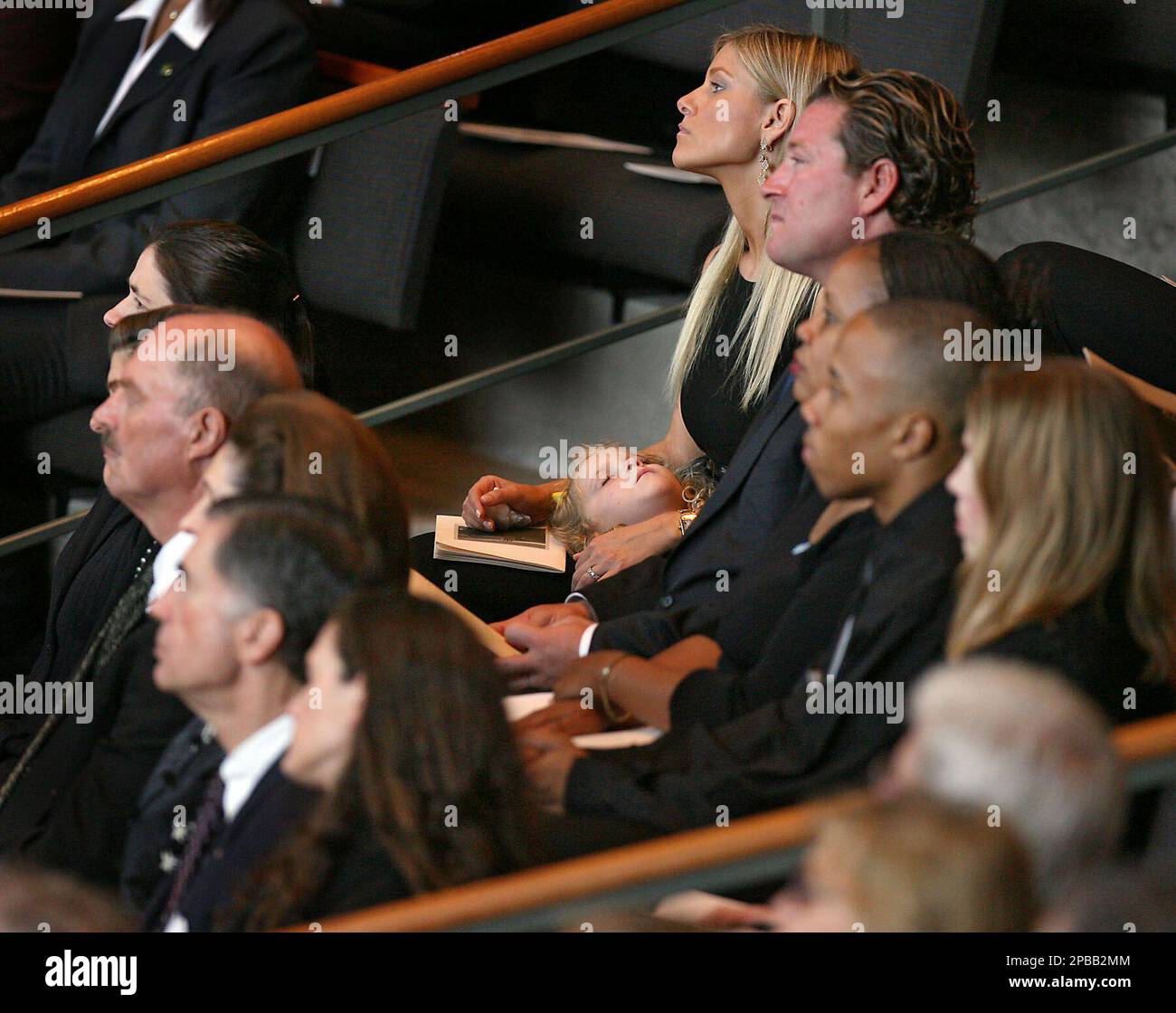 Sophia Brod, 3, sleeps in the laps of her parents, Claudia and Steven ...