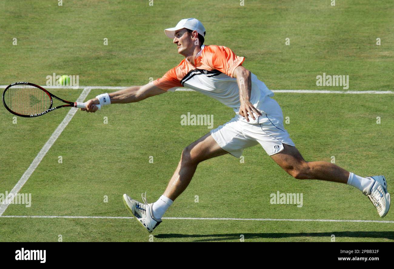 Wesley Moodie of South Africa reaches for a volley to opponent Fabrice ...