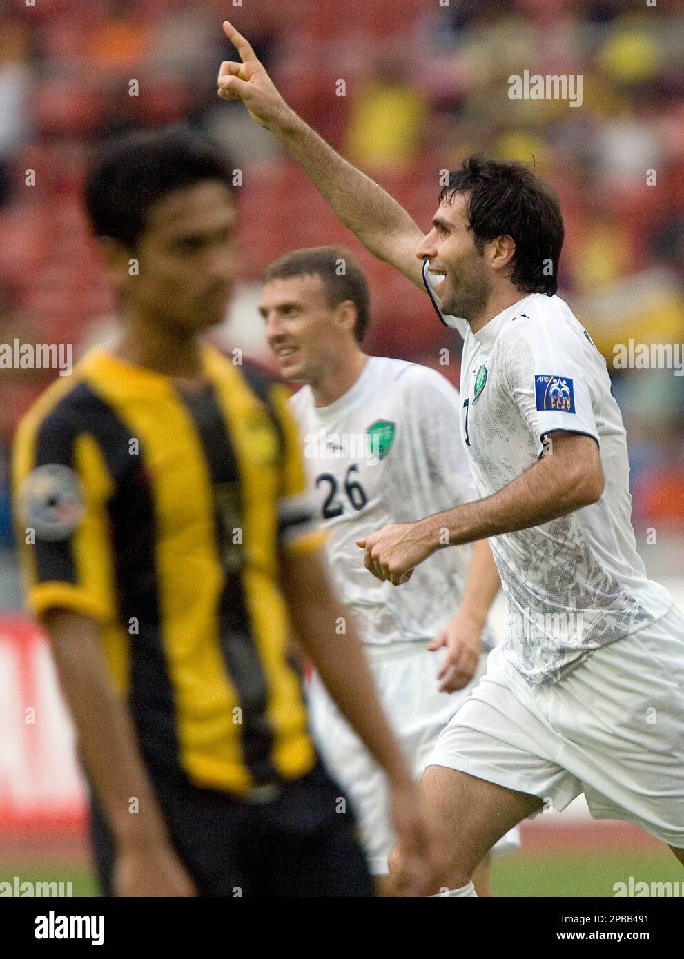 Uzbekistan's Kapadze Timur, right, celebrates after scoring second goal ...