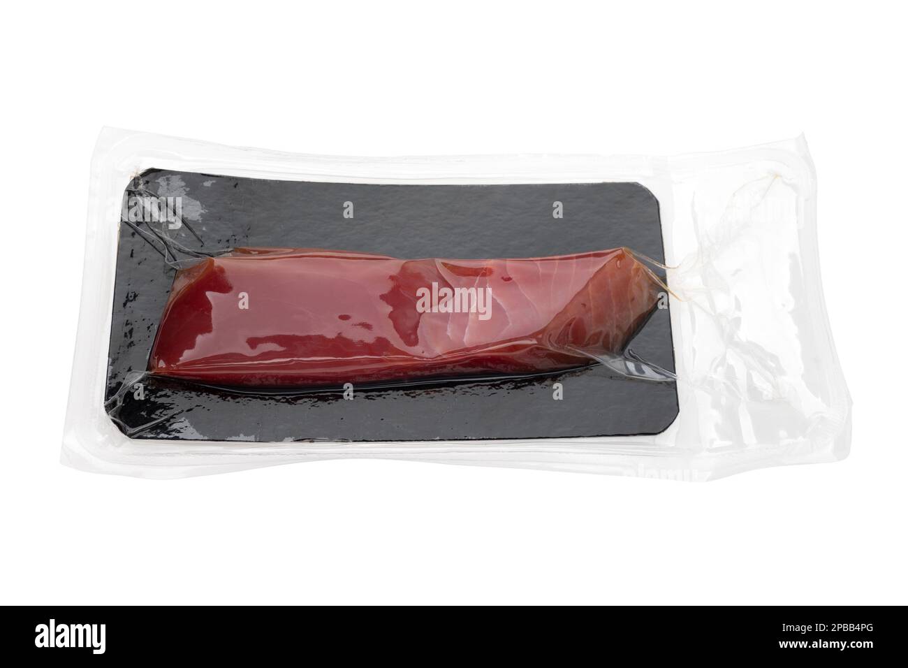 Vacuum packed tuna on a white background. A piece of fresh tuna in the ...