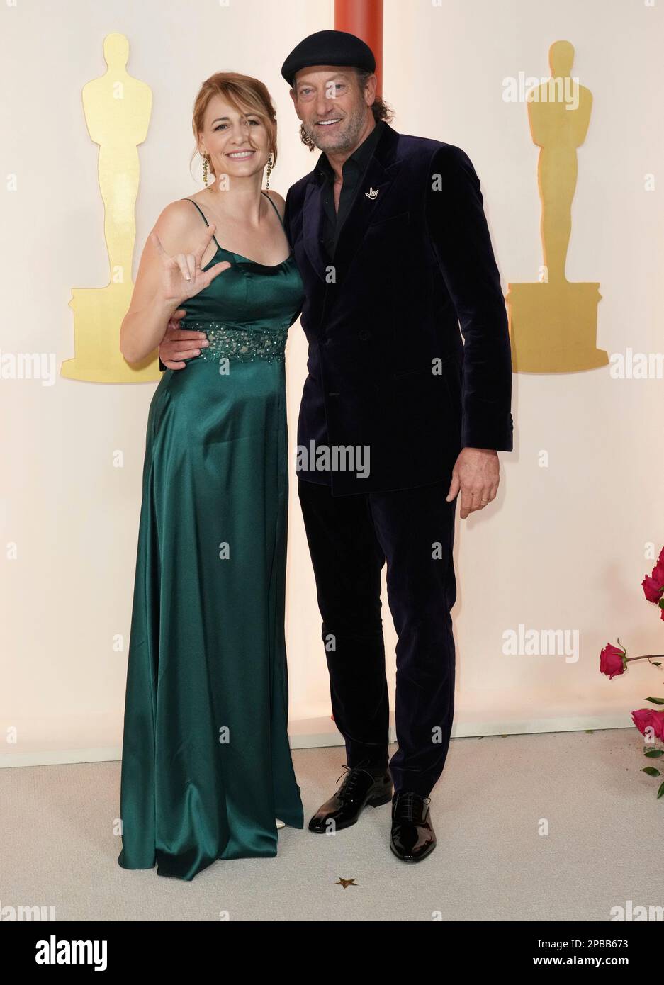 Deanne Bray, left, signing 'I love you' and Troy Kotsur arrive at the ...