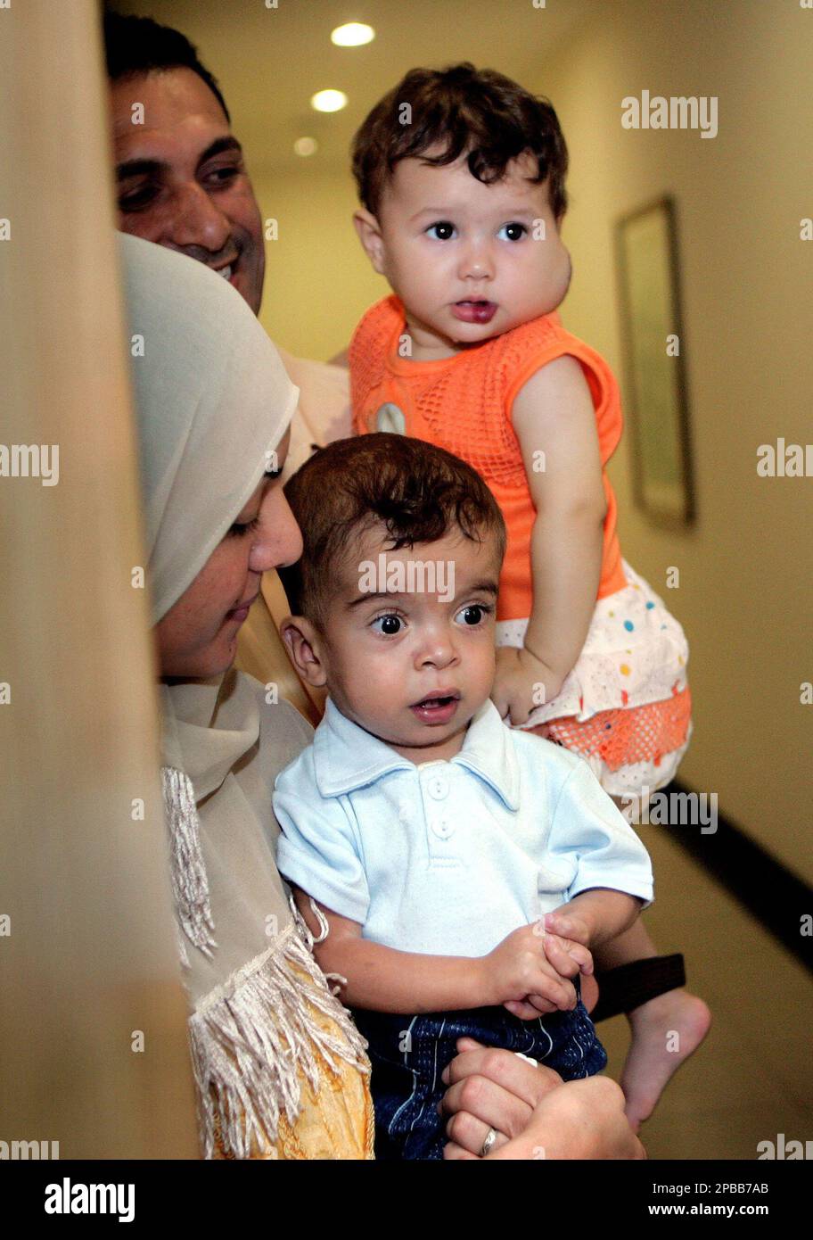 Iraqi children arrive with their parents for a press interaction after ...