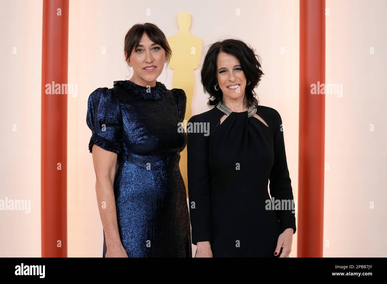 Beth Levison, left, and Annie Alvergue arrive at the Oscars on Sunday ...