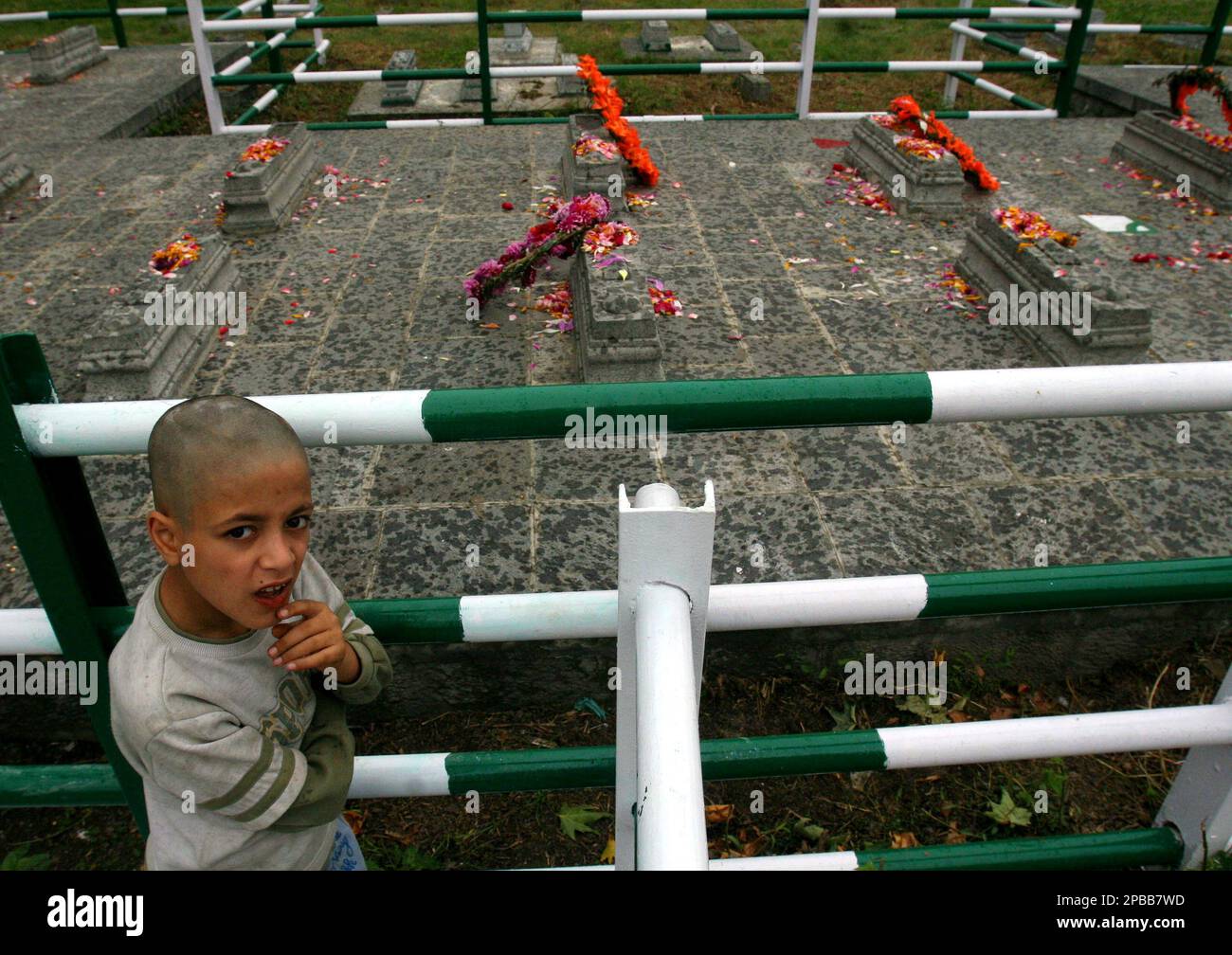 Kashmiri boy Danish, 8, looks on at the Martyrs Graveyard in Srinagar ...