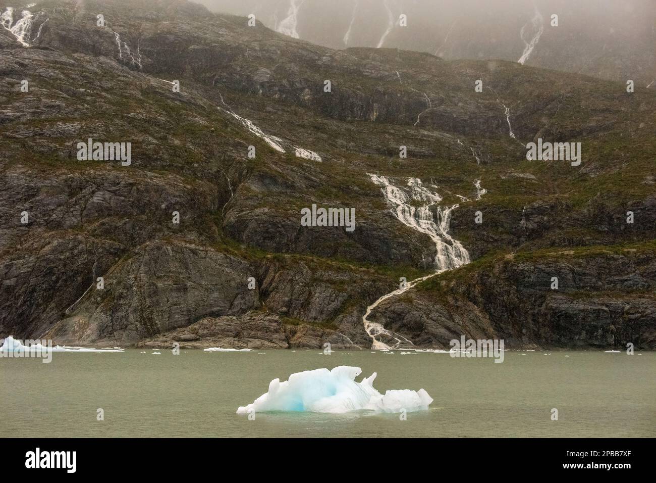 Waterfalls and icefloes, rainy day, Peninsula Videau near Glacier Jorge ...