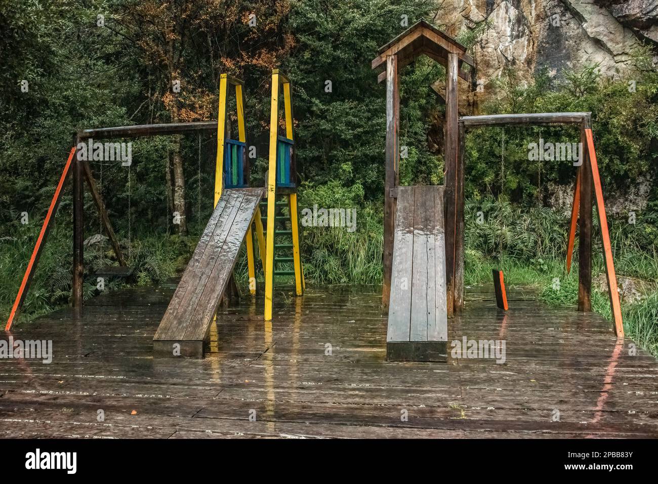 Playground in the rain, Caleta Tortel, Patagonia, Chile Stock Photo - Alamy
