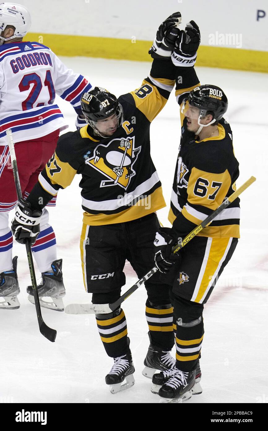 Pittsburgh Penguins' Rickard Rakell (67) celebrates his goal with ...