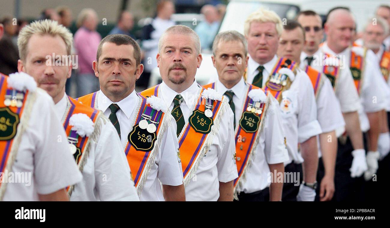 Orange Order members parade through a loyalist part of east Belfast ...
