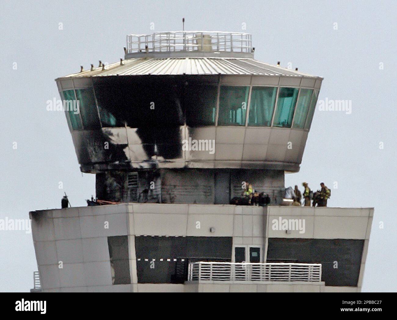 Miami-Dade County firefighters work on a control tower Wednesday, July ...